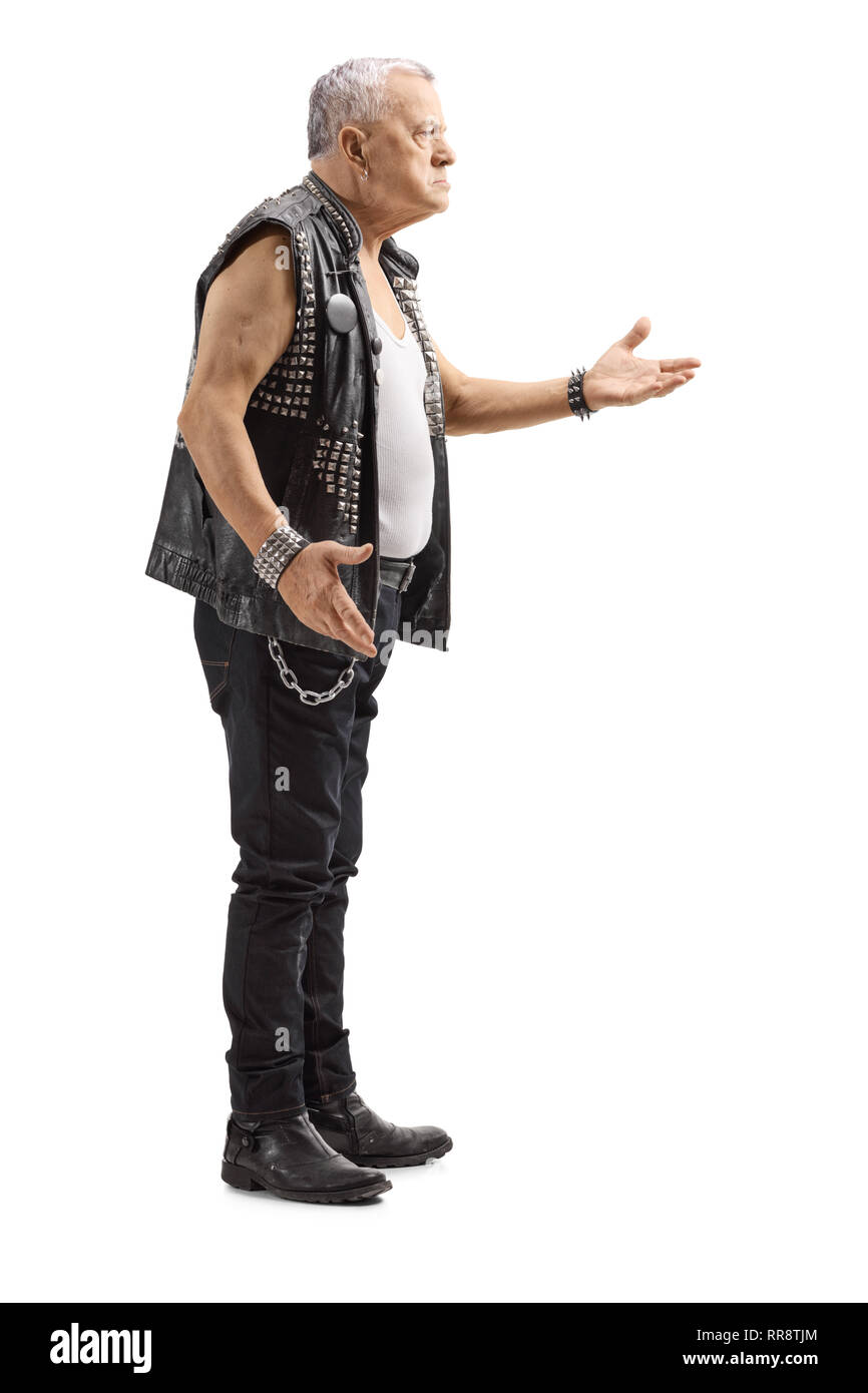 Full length profile shot of a mature man in a leather vest with an ...