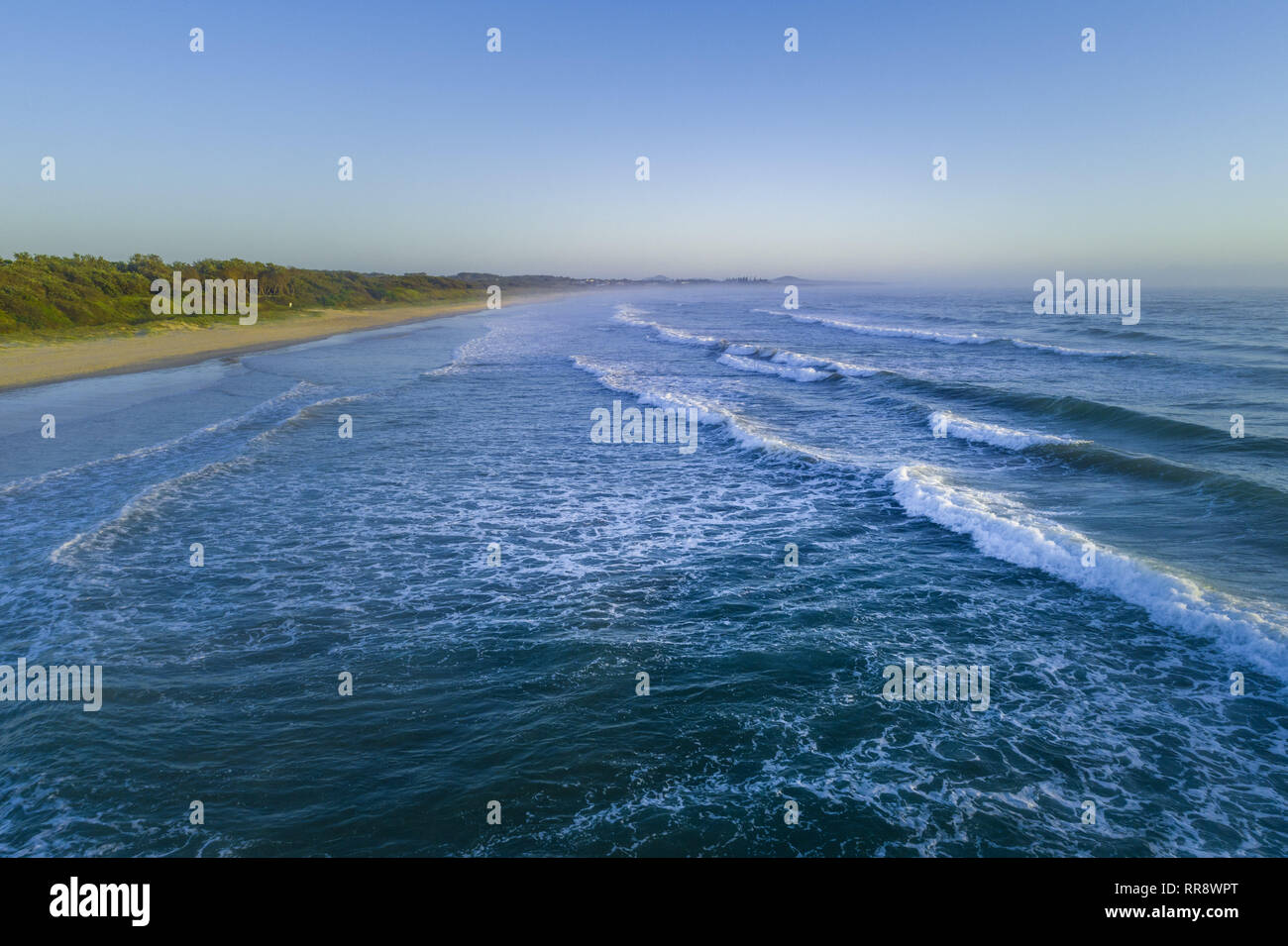 Aerial view of ocean waves coming onto the shore in the morning Stock ...