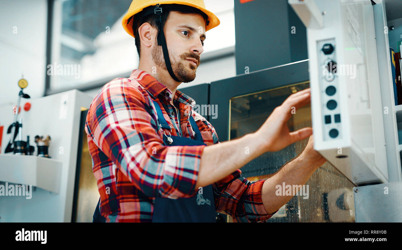 modern industrial machine operator working in factory Stock Photo - Alamy