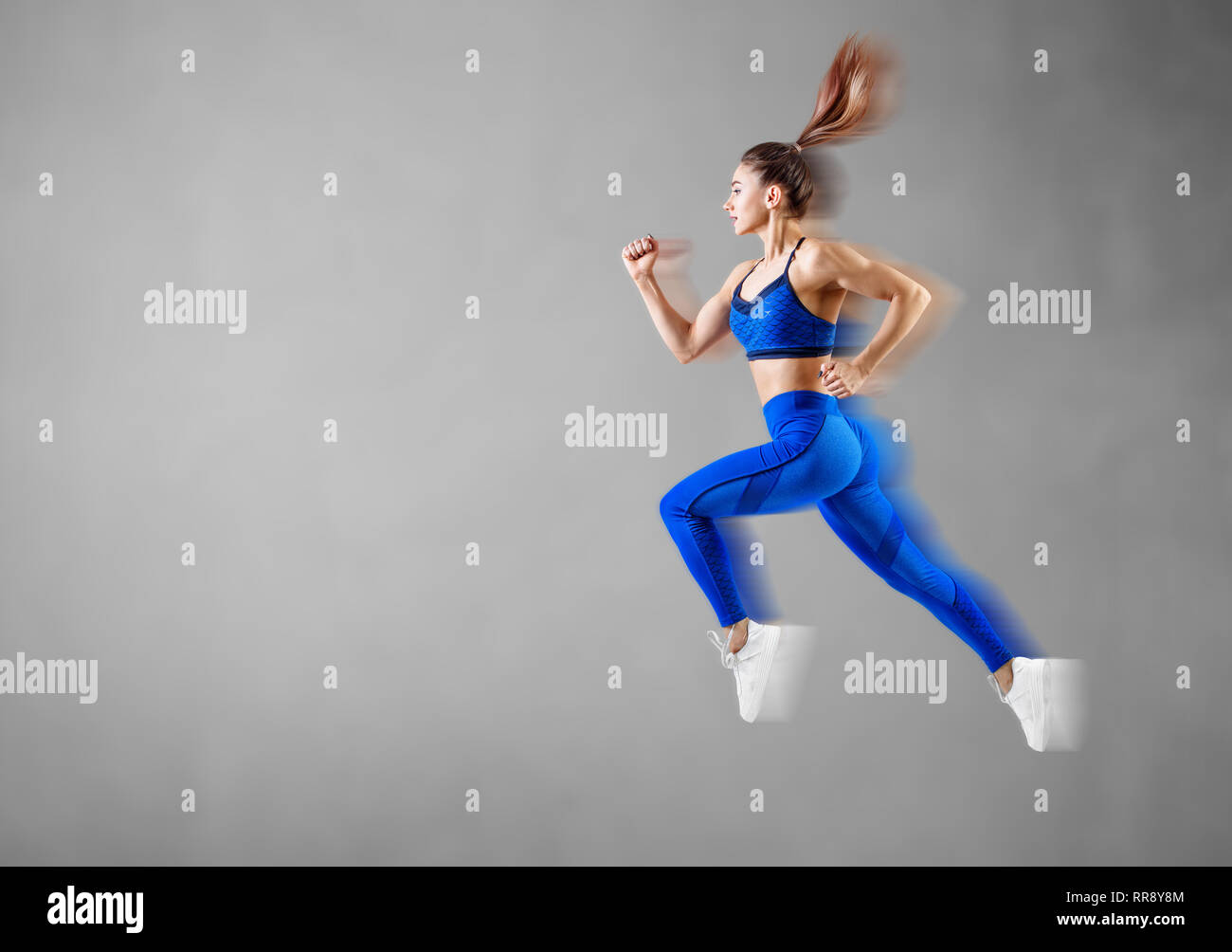 Very speed athletic woman running with speed trail Stock Photo - Alamy