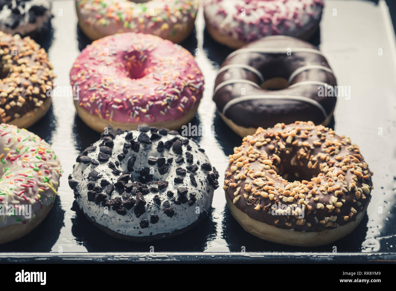 Sweet and fresh donuts with sweet glaze Stock Photo - Alamy