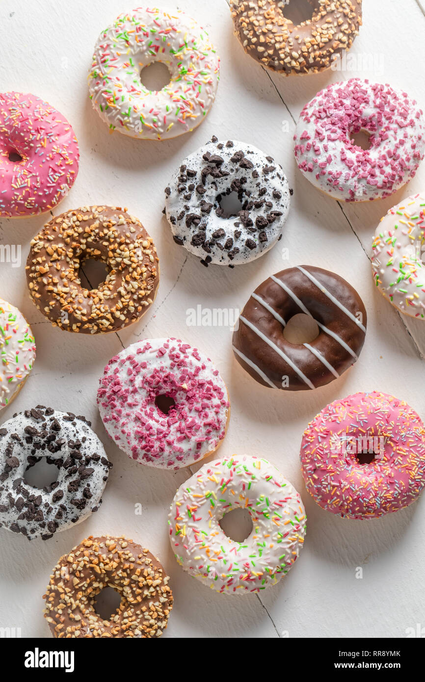 Sweet and fresh donuts with various types of toppings Stock Photo - Alamy