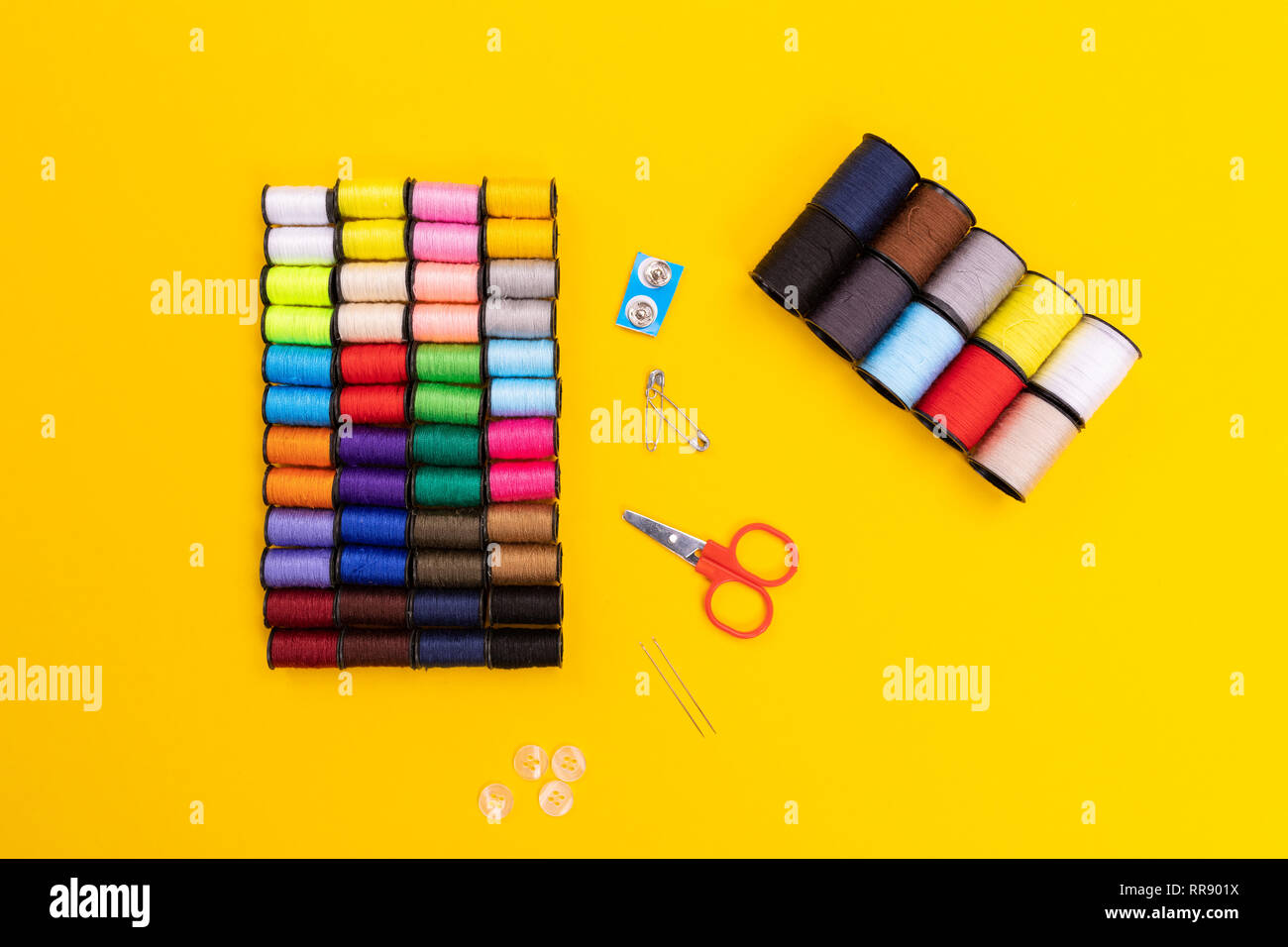 scissors, buttons and pins isolated on a bright background Stock Photo ...