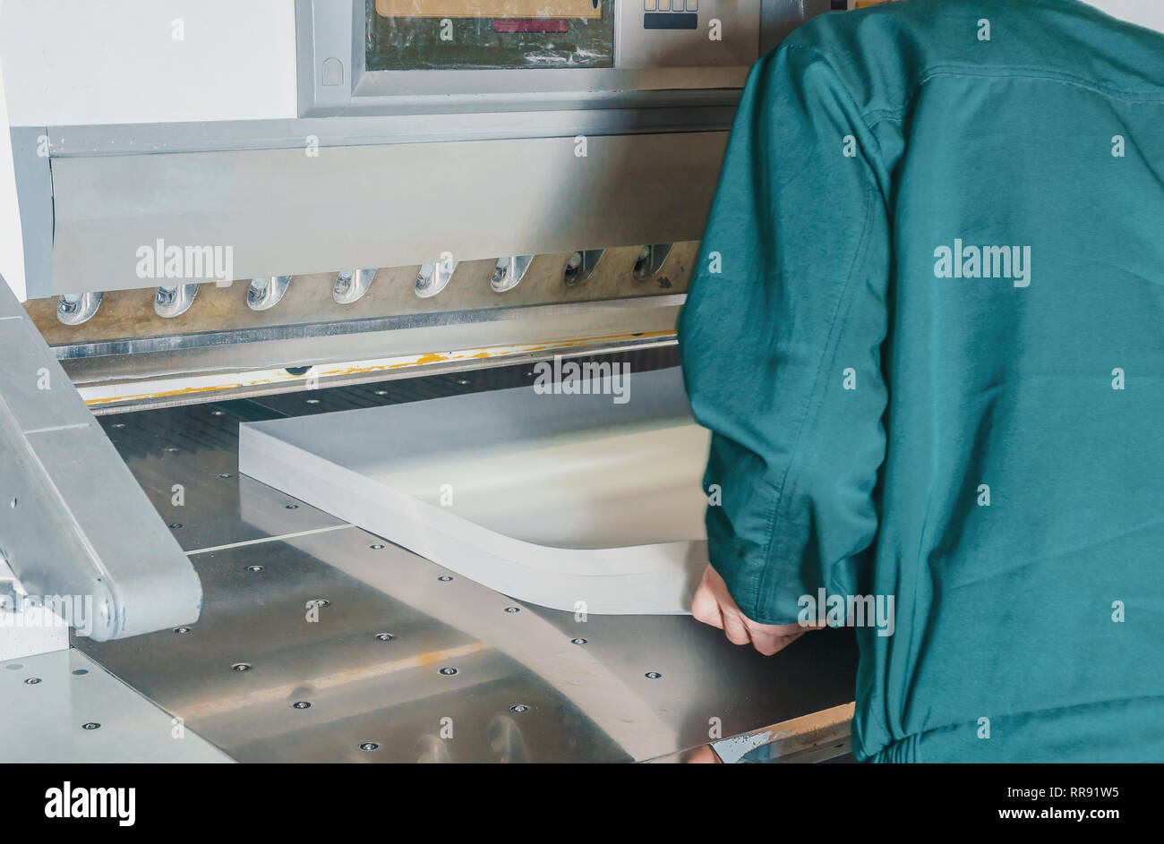 Large electronic knife for cutting paper in the printing Stock Photo ...