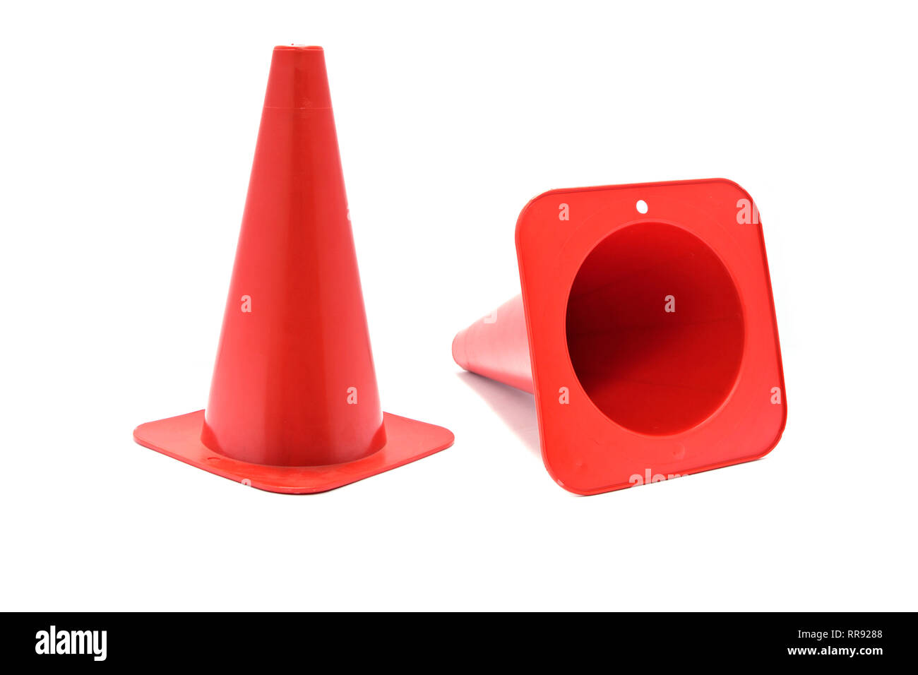 Red plastic cone with reflective stripes isolated on white background ...