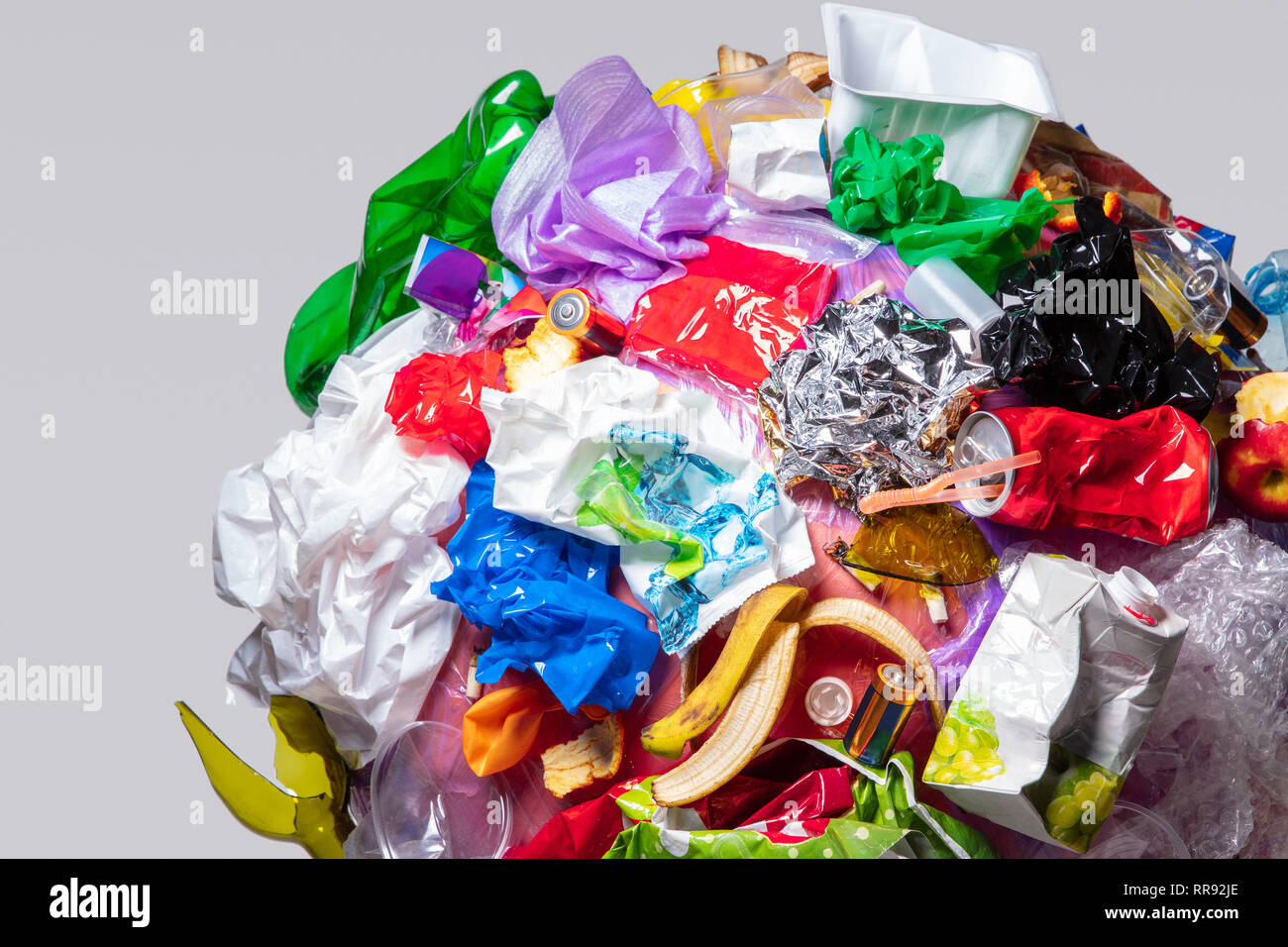 A globe of the earth with trash over white background, the concept of ...