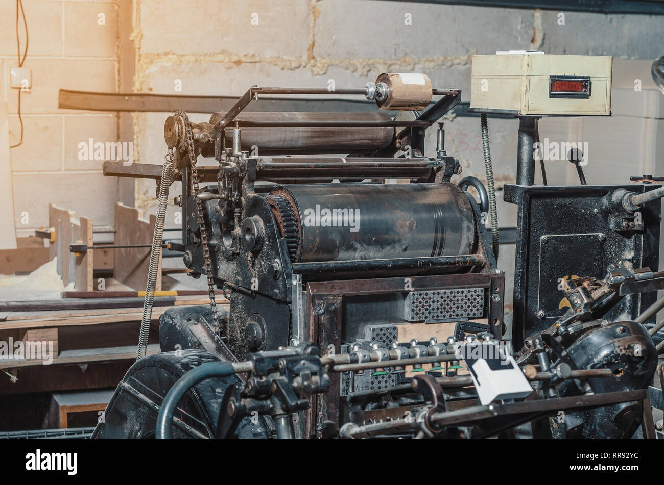 Vintage printing machine for carving in printing. Part of old mechanism ...