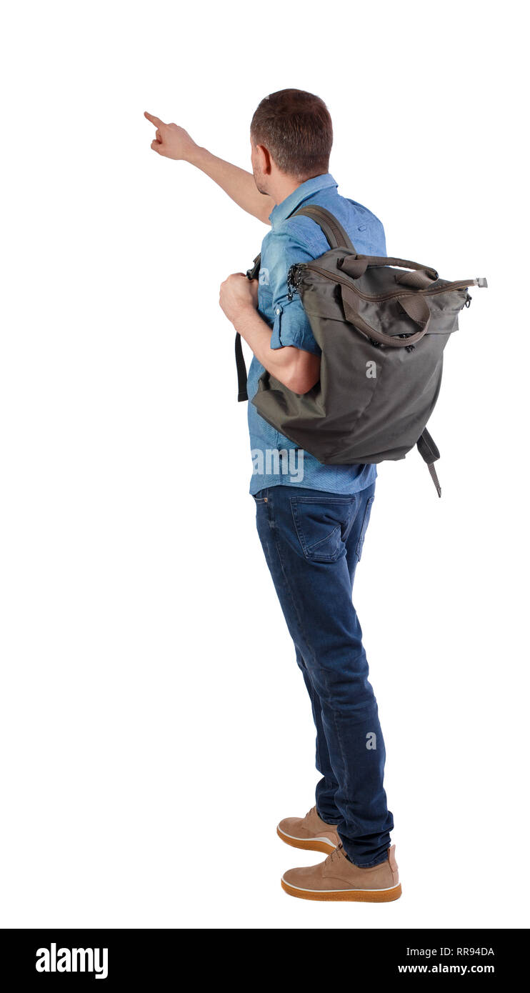 Back view of a man with a green backpack pointing forward. backside ...