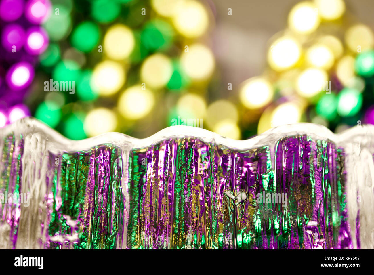 Abstract art macro background view of the curved edge of a frosted lead ...
