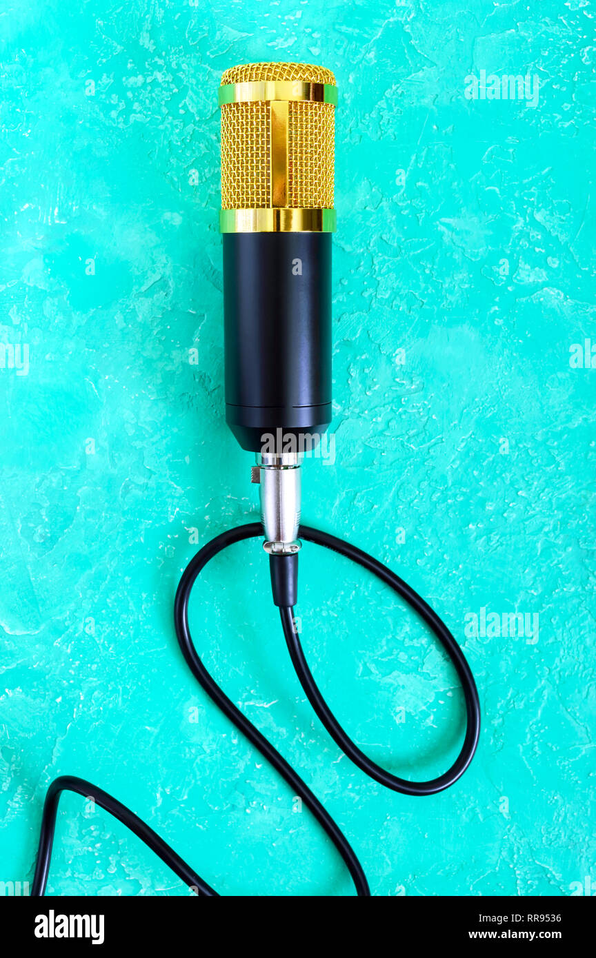 Beautiful golden microphone on a bright background. The top view Stock ...