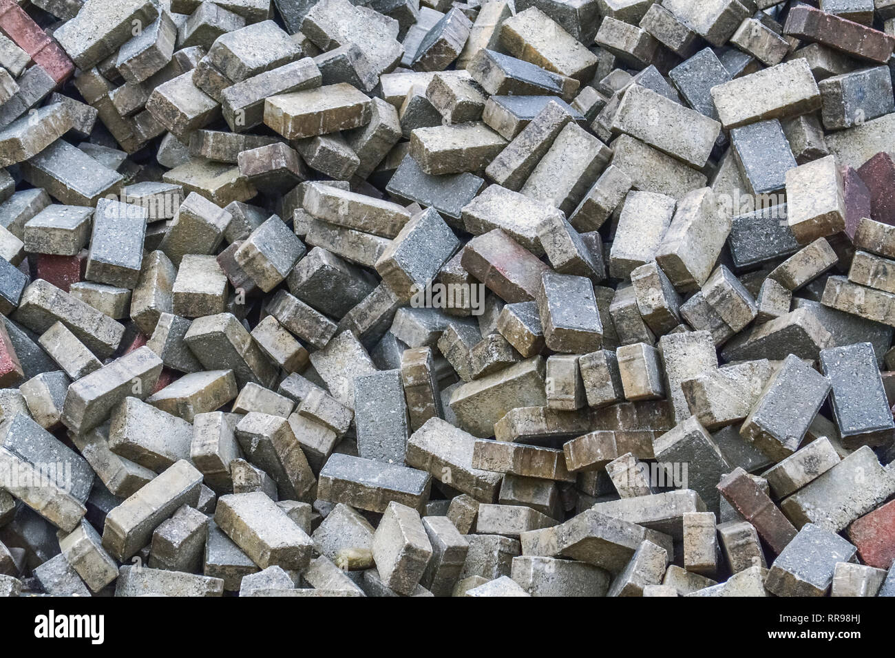 Pile of old bricks after renovation of the pavement Stock Photo - Alamy