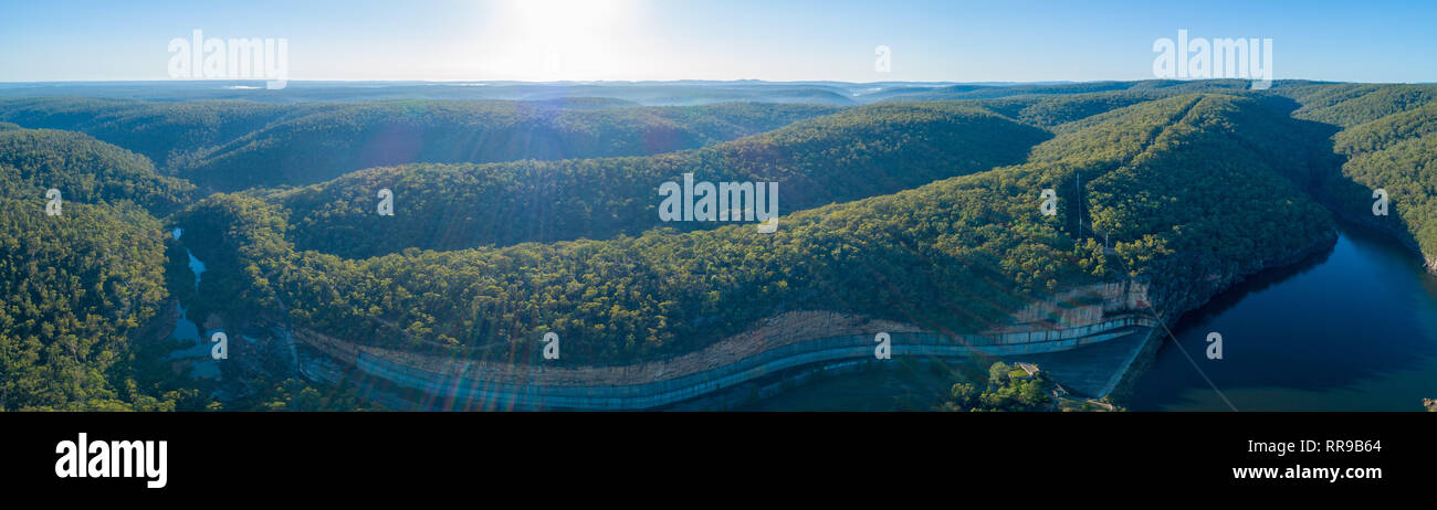 Wide aerial panorama of Lake Nepean Dam and forested hills. Bargo, New ...