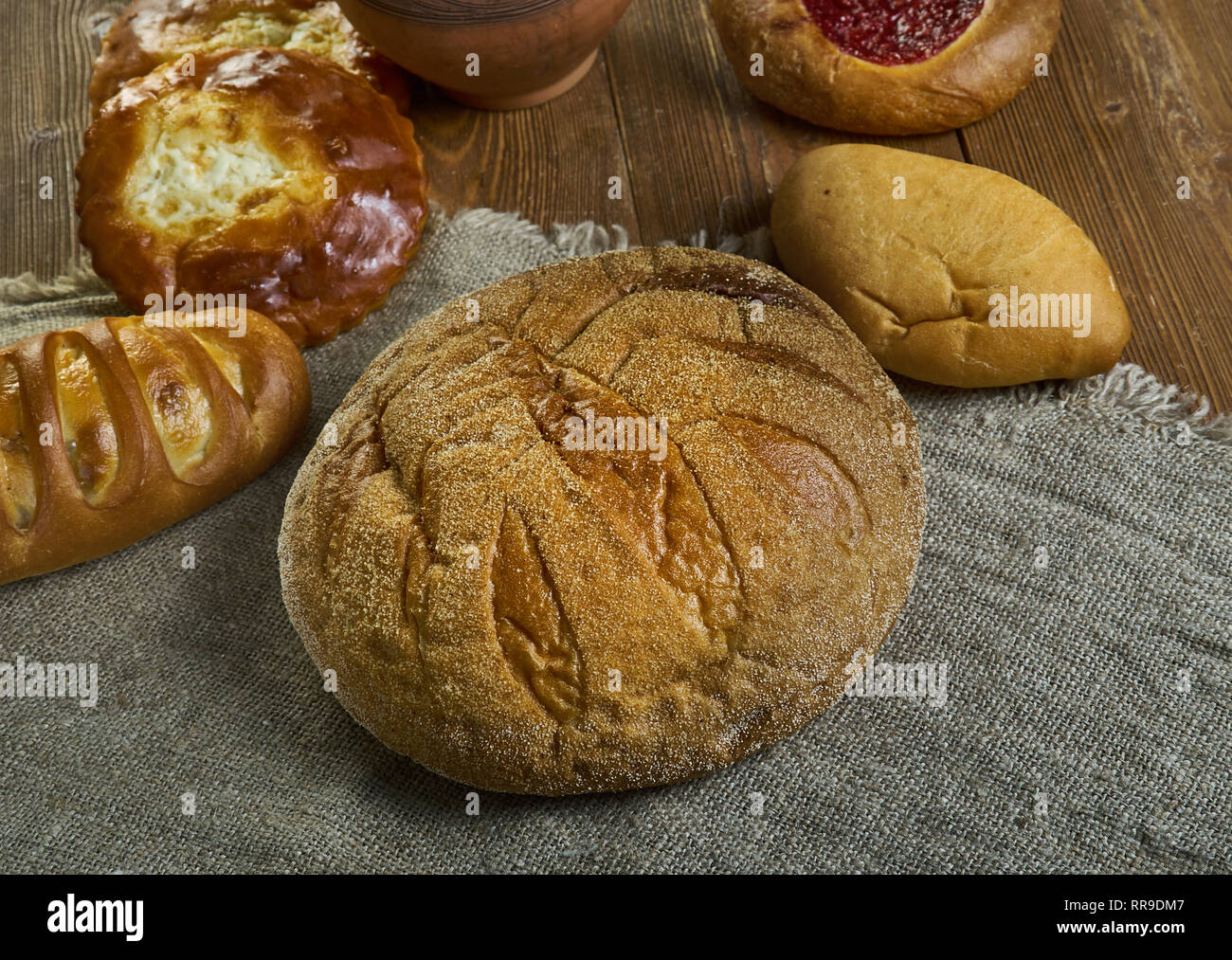 Rustic rye bread , Russian traditional pies piroshki , assorted pastry ...