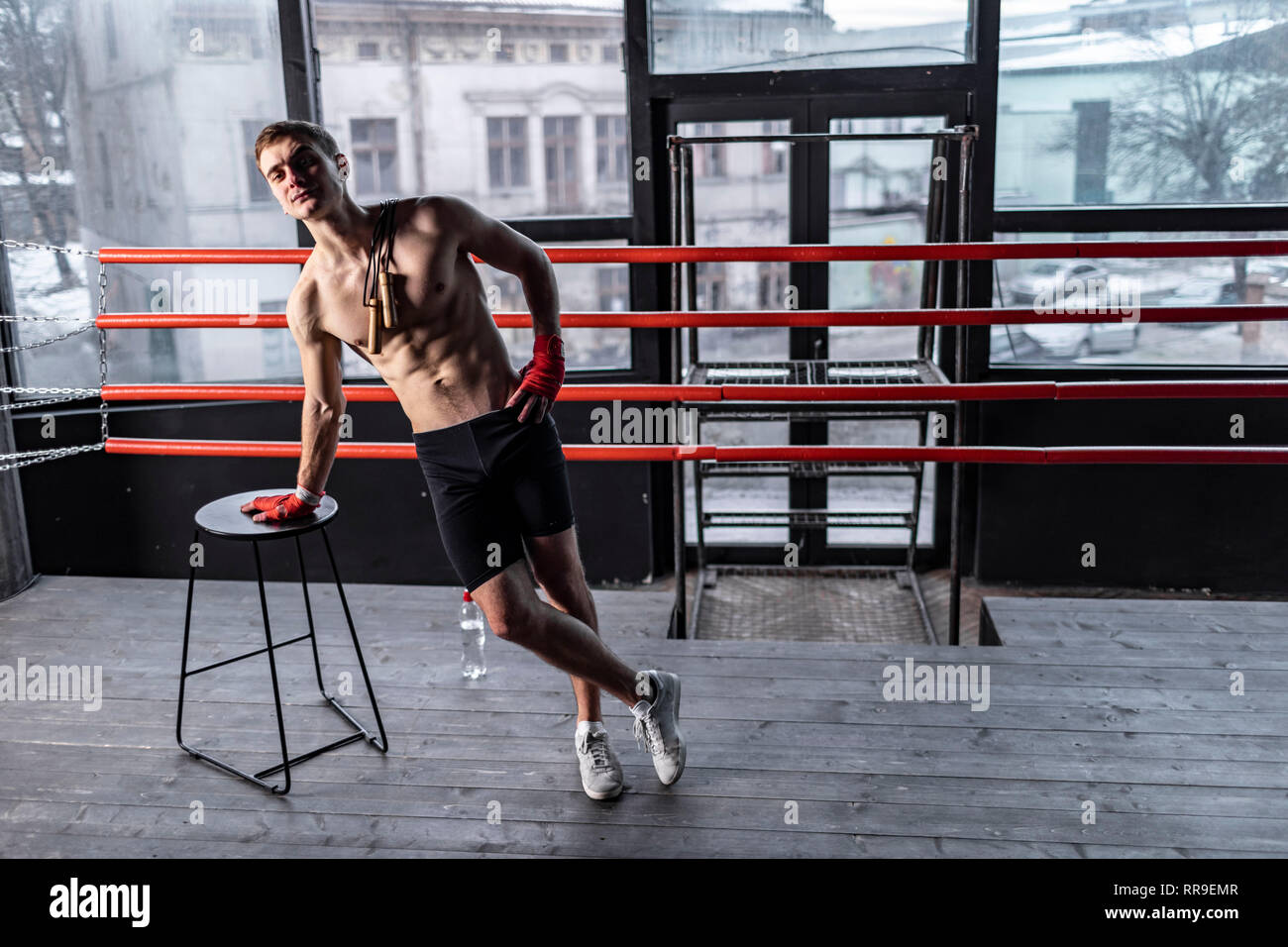 Muscular athlete man with rope near chair in the ring Stock Photo - Alamy