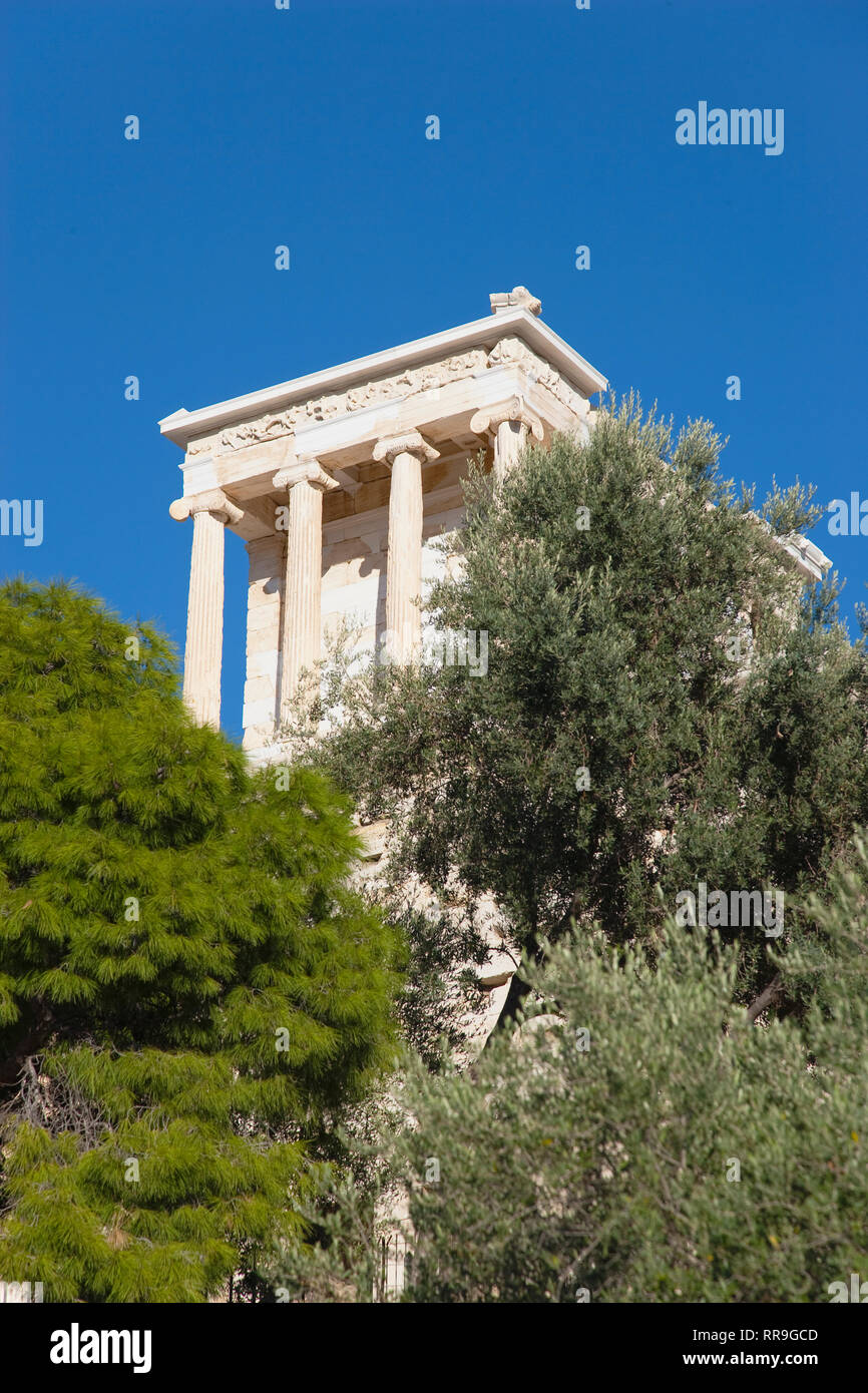 Greece, Attica, Athens, Acropolis ruins seen through trees Stock Photo ...