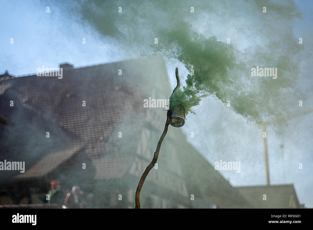green smoke at a carnival event in the blue sky Stock Photo - Alamy