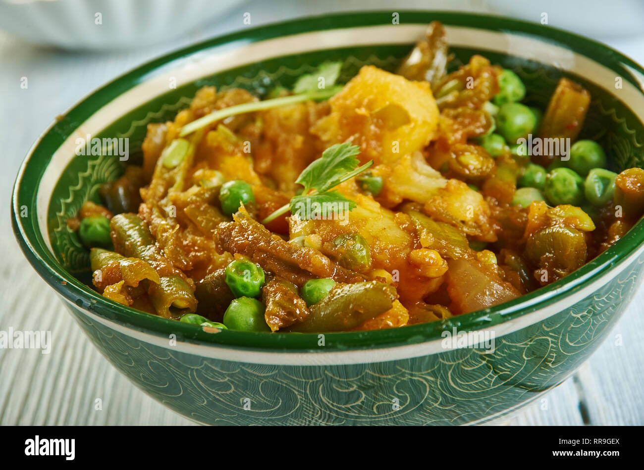 Sem Matar Aloo - Indian Beans and Potato vegetable Stock Photo - Alamy