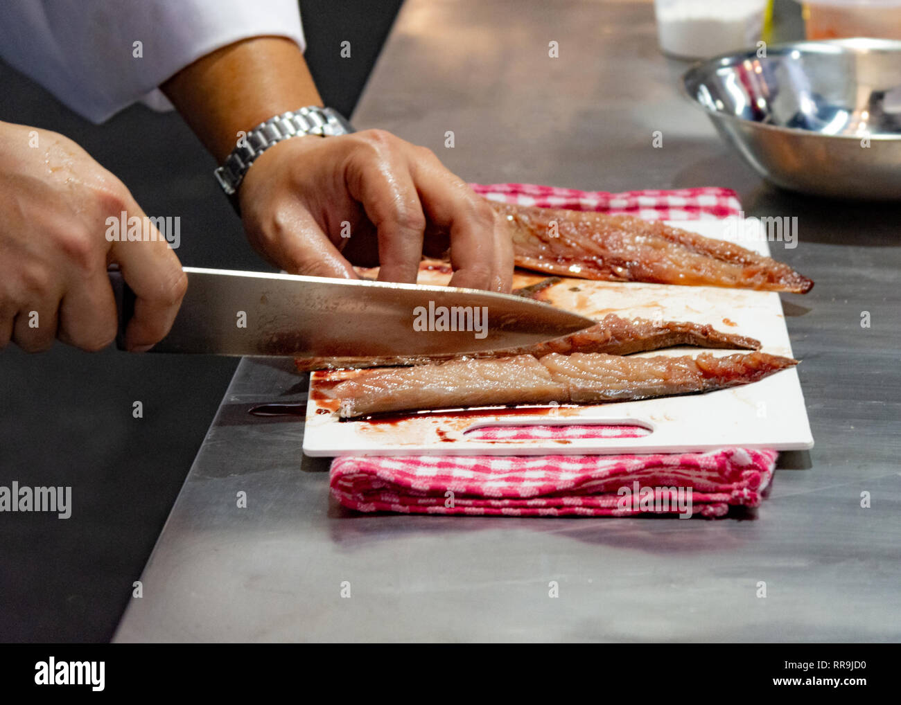 Chef cutting fish, Chef slices fish fresh on Board in the kitchen Stock ...