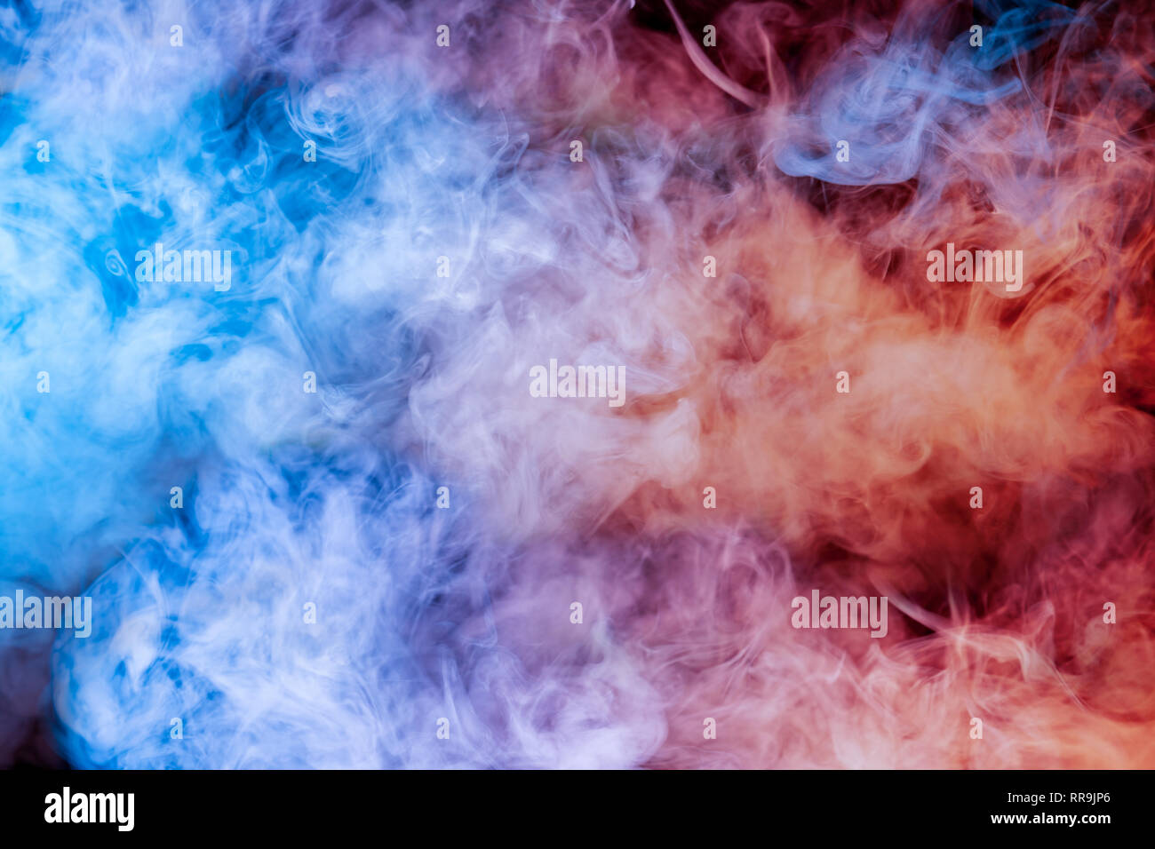 Translucent, thick smoke, illuminated by light against a dark ...