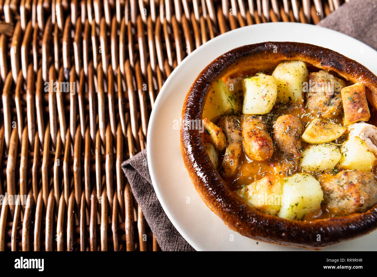 Open Pie with Potatoes and different kinds of meat on rustic background ...