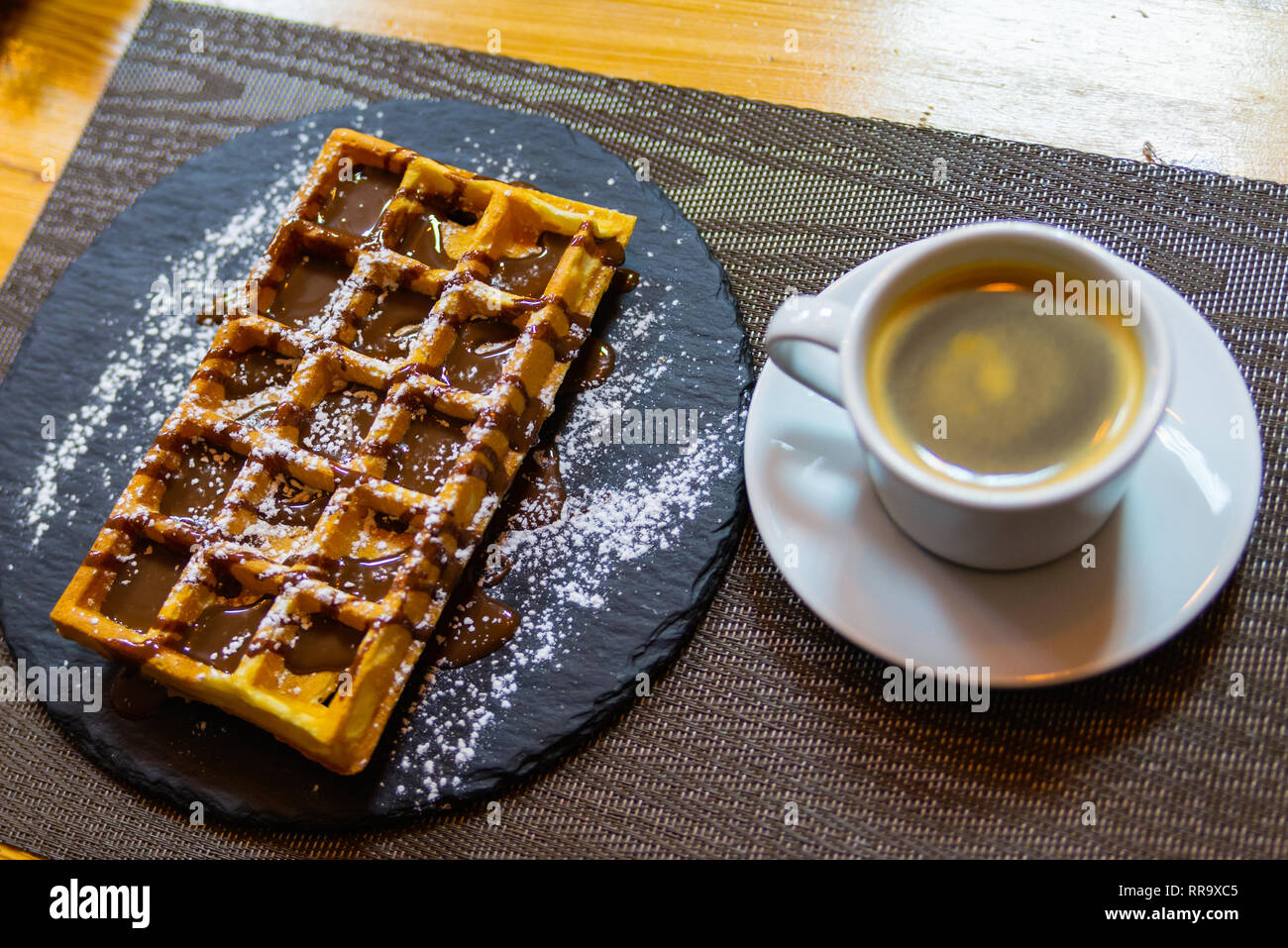 Cup of coffee and Belgian waffles with chocolate Stock Photo - Alamy
