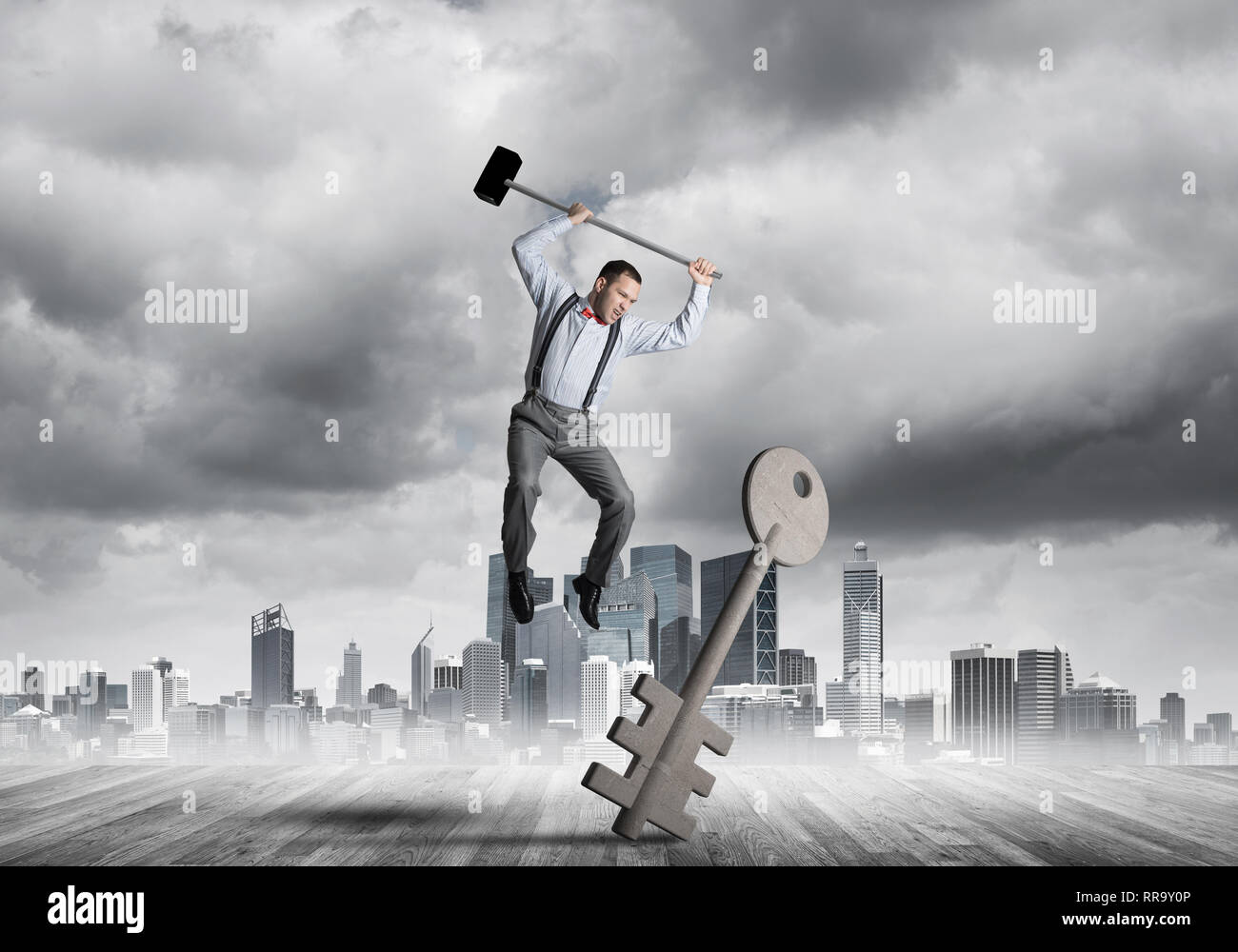 Breaking through access concept with man in anger crashing concrete key ...