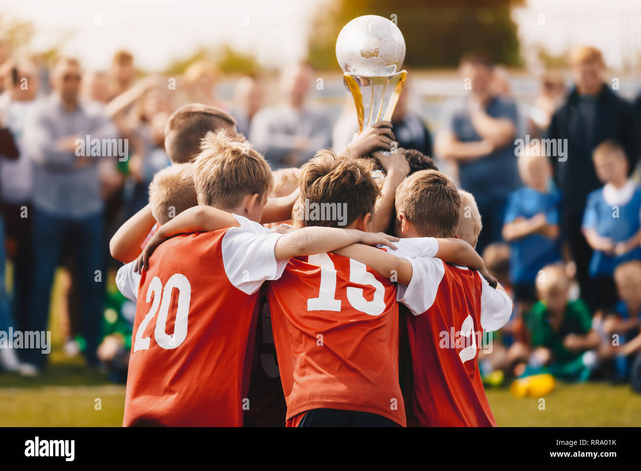 Young Athletes from School Sports Team Holding Winning Trophy. Kids ...
