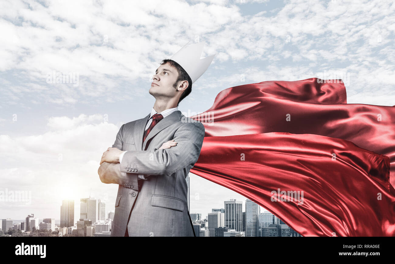 Concept of power and sucess with businessman superhero in big city ...