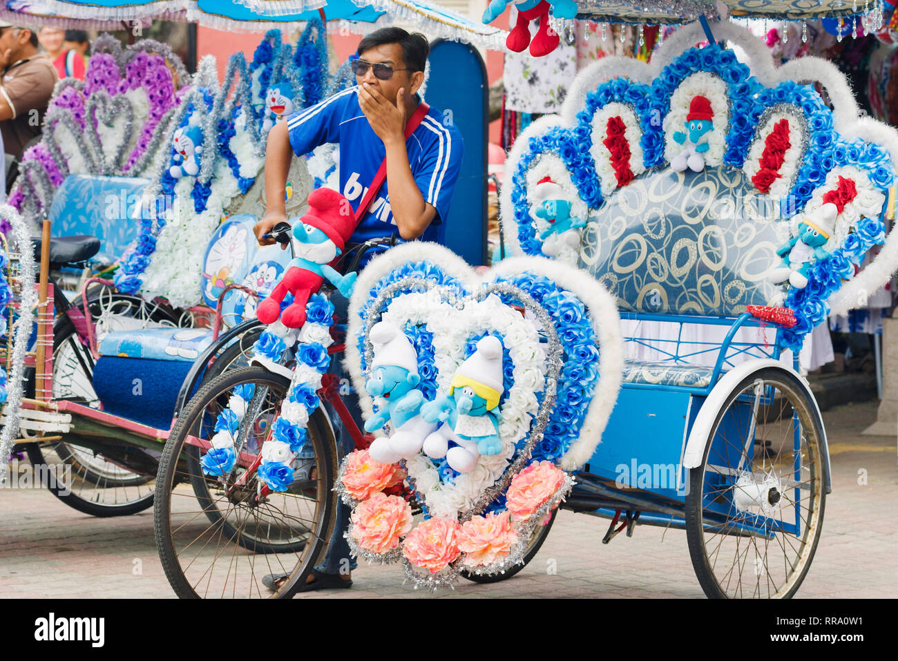 the colorful trishaws, a form of bicycle-powered rickshaw, that cruise ...