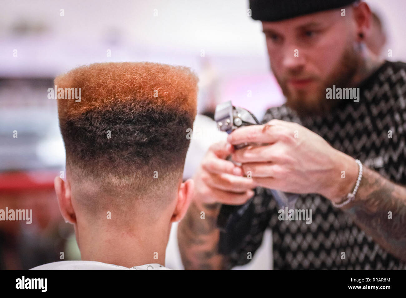 Excel, London, UK. 25th Feb, 2019. Precision hairstyles are applied at ...
