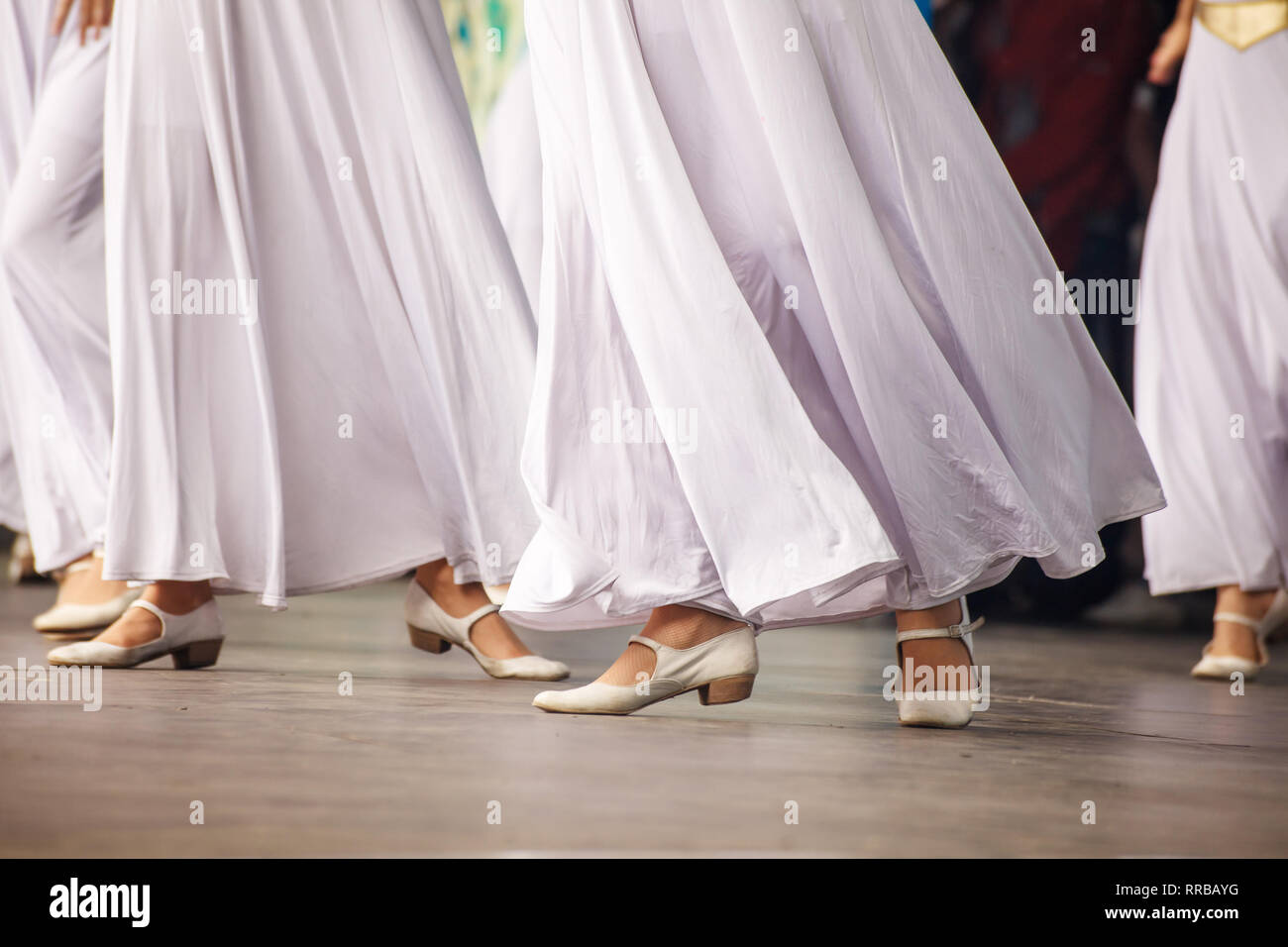 girls dancing onthe stage outdoor in the park. body parts closeup Stock ...