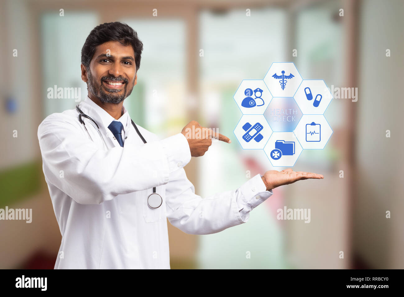 Indian physician or medic presenting health check concept by symbols on ...