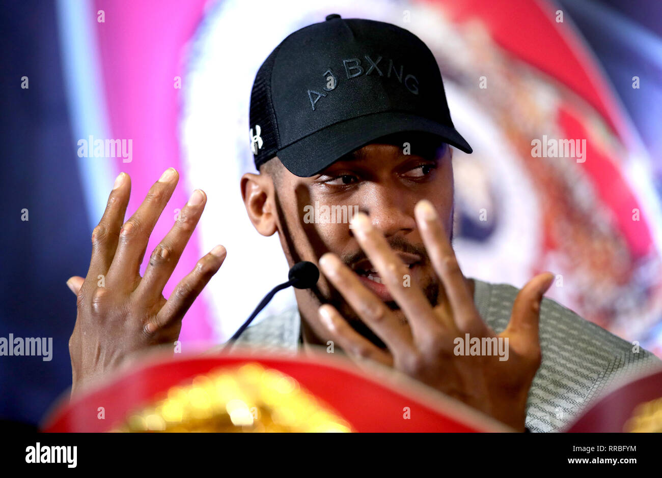 Anthony Joshua shows the scars on his hands during the press conference ...