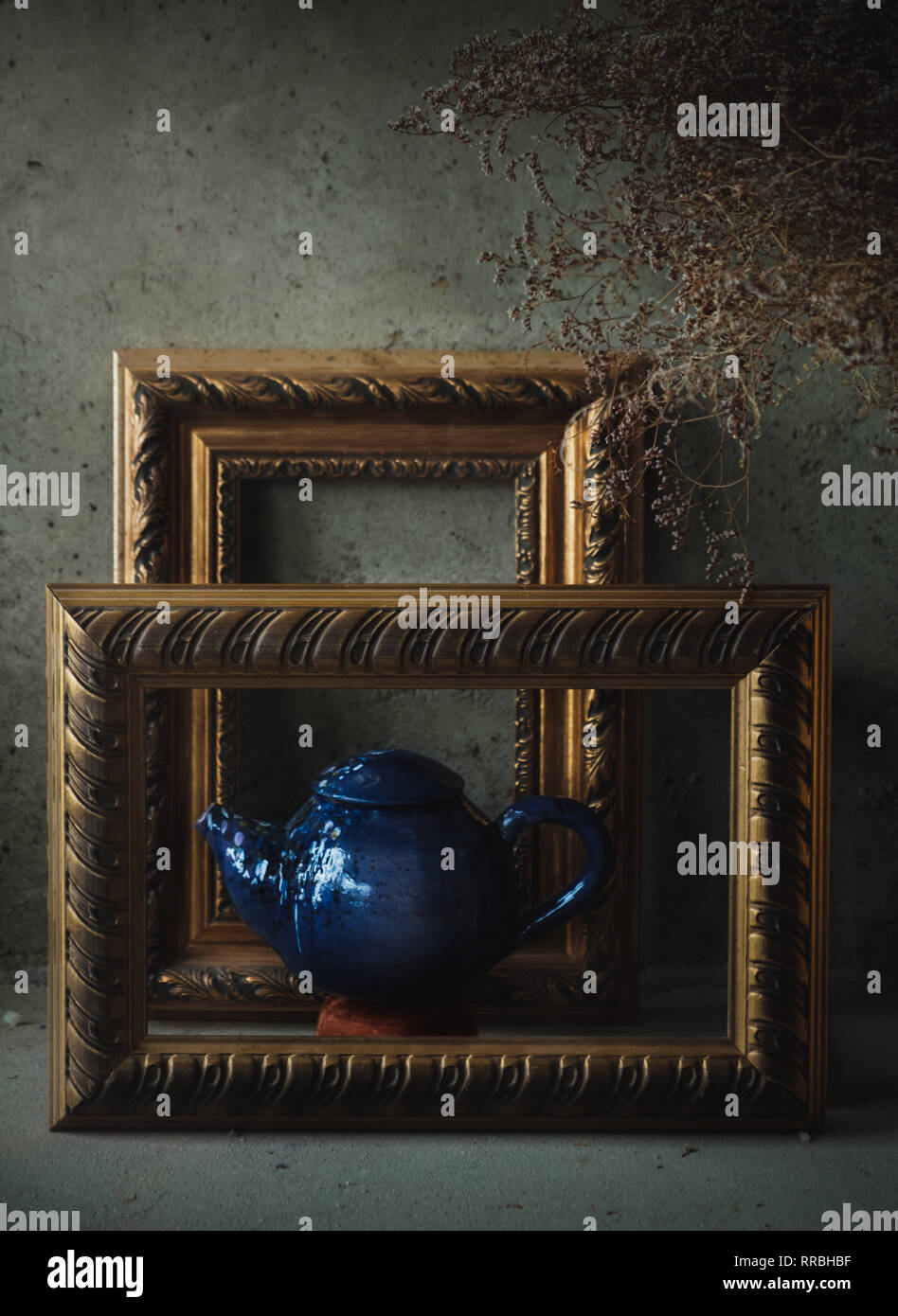 Side view on Side view ceramic blue tea pot looking like a painting in ...