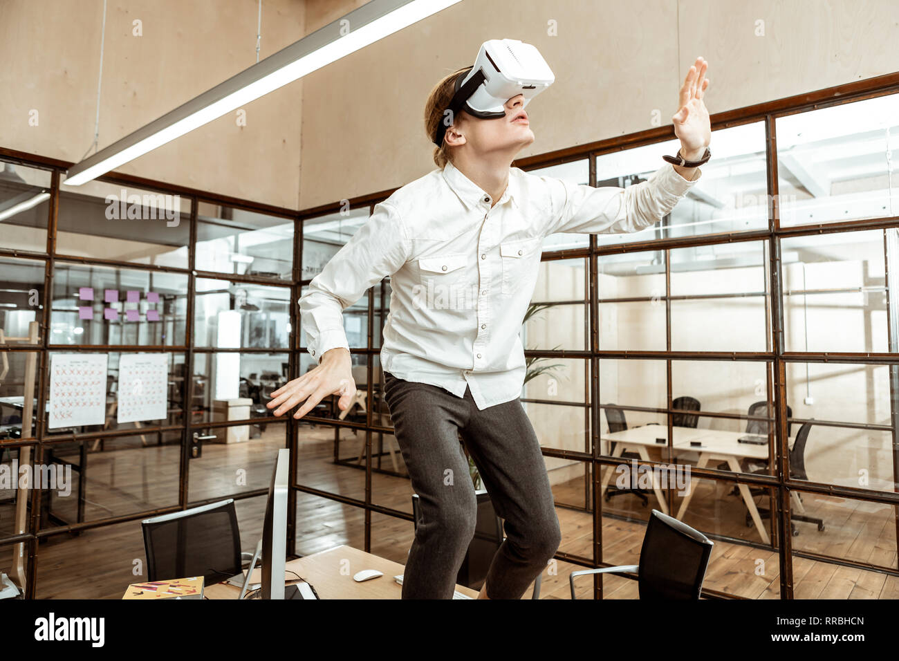 Pleasant good looking man testing 3d glasses Stock Photo - Alamy