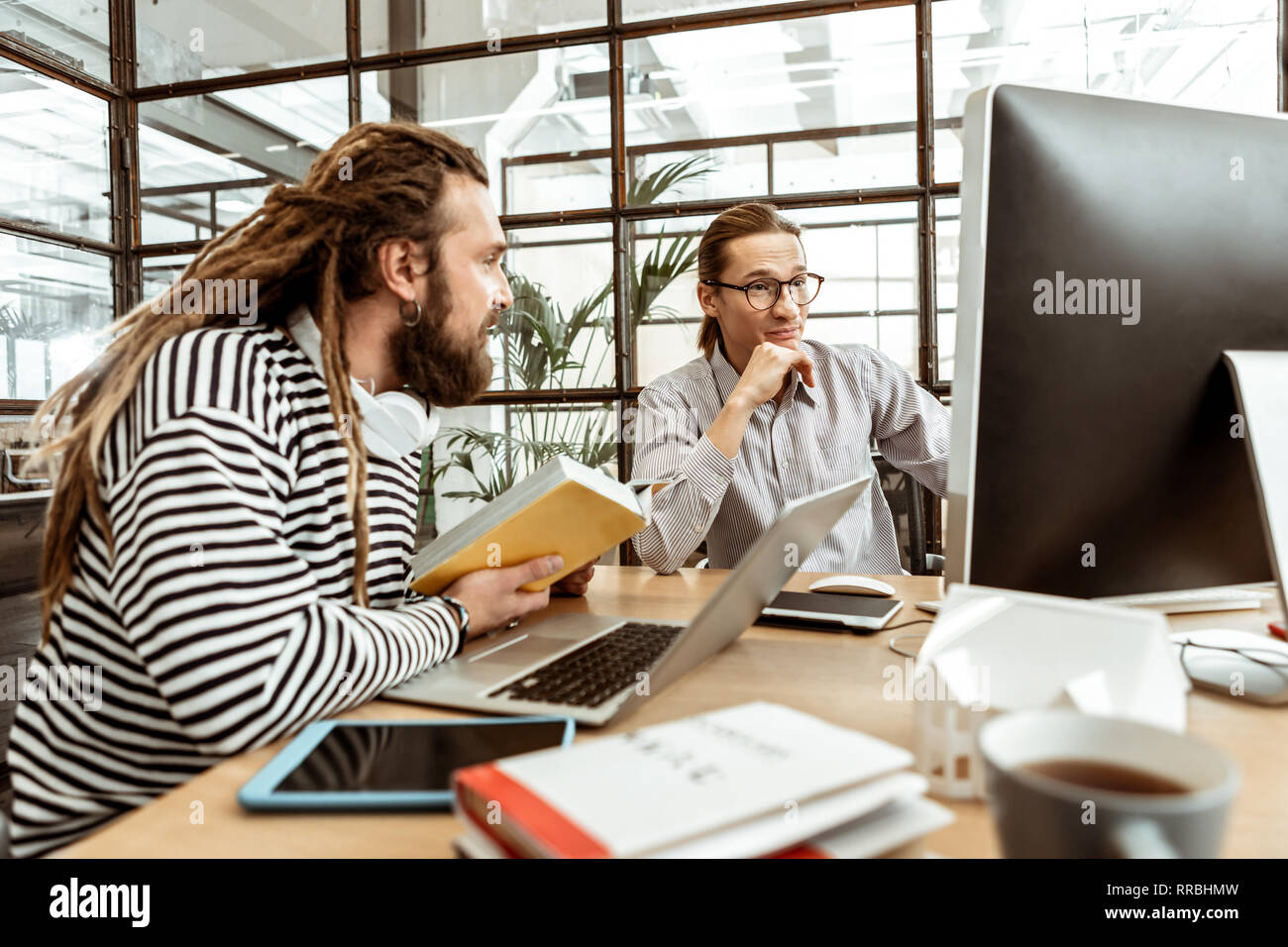 Nice smart men working on a project Stock Photo - Alamy
