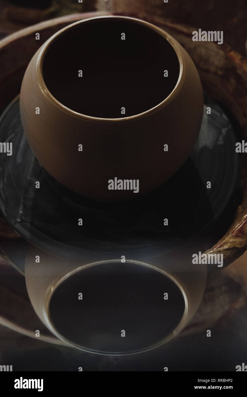Top view from above raw ceramic bowl drying on pottery wheel, beautiful ...