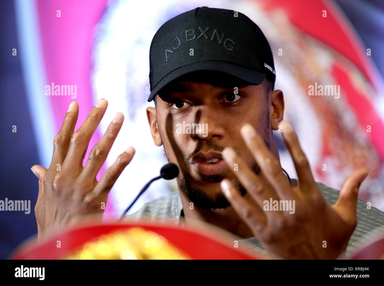 Anthony Joshua shows the scars on his hands during the press conference ...