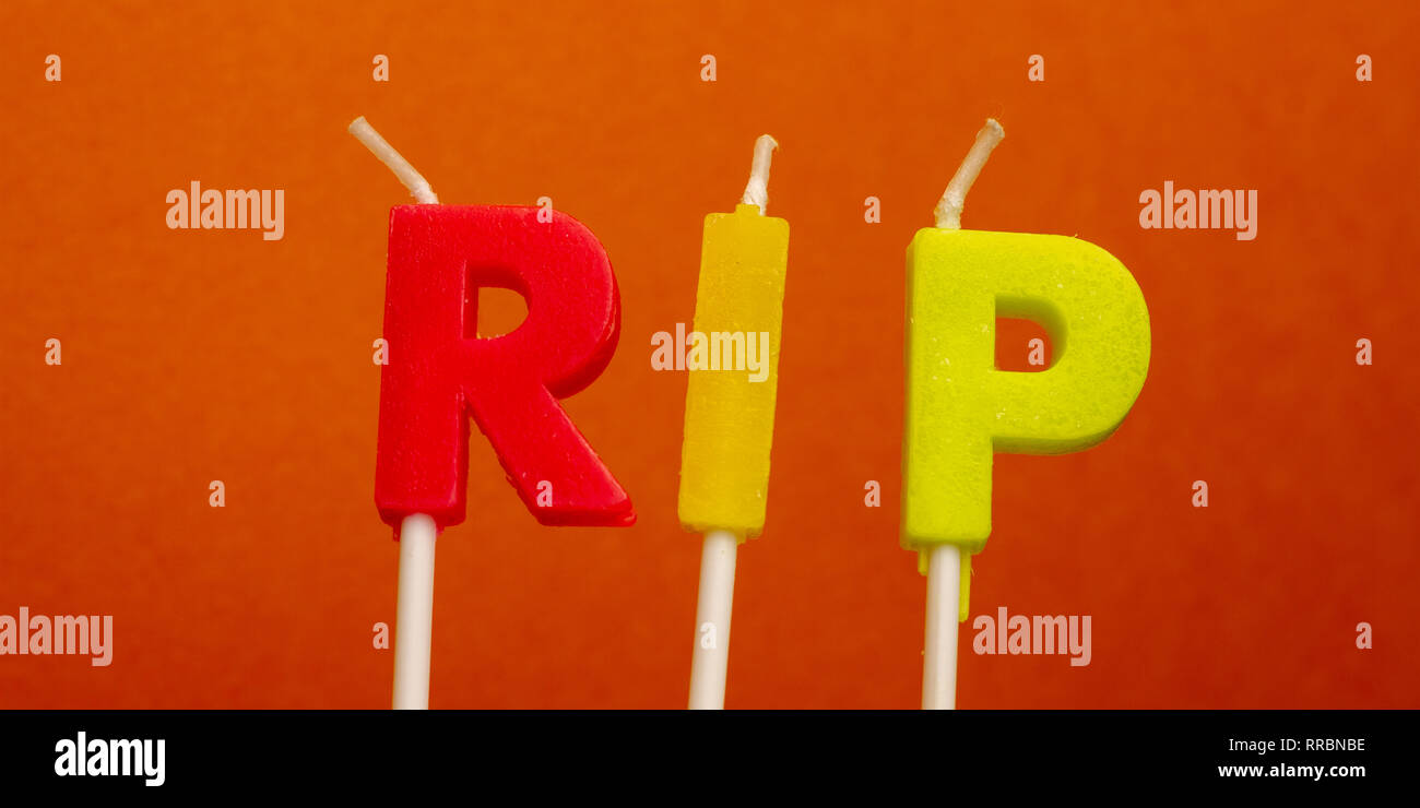 Banner horisontal concept word RIP from festive multi-colored wax ...