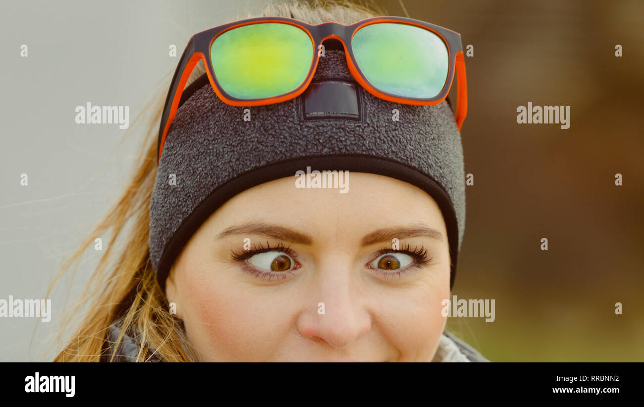Silly woman making funny face and squinting eyes outdoor Stock Photo ...
