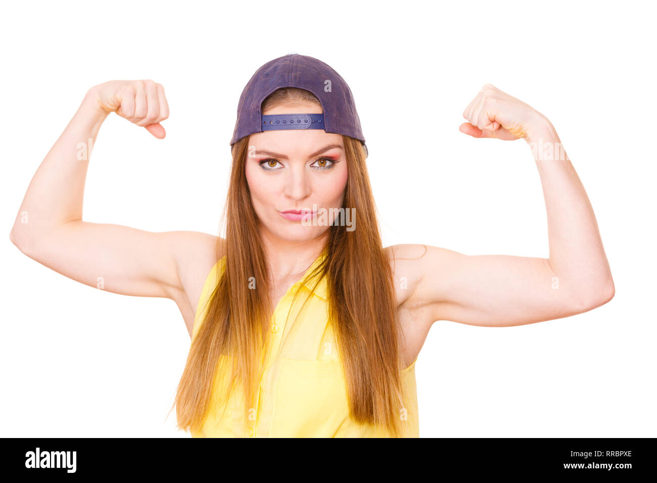 Woman casual style teen girl cap on head showing off muscles biceps ...