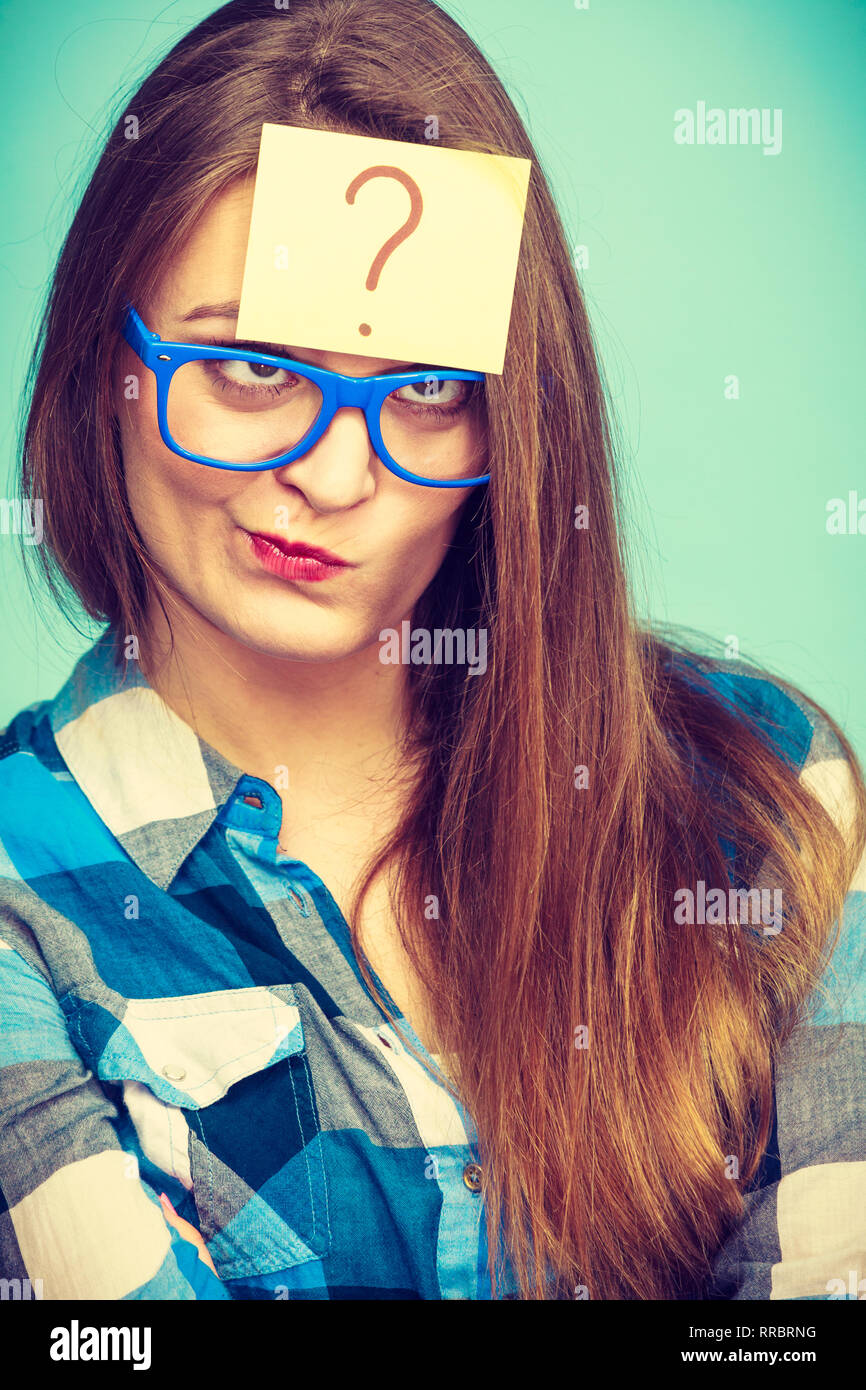Thinking woman with big nerdy eyeglasses and question mark on forehead ...