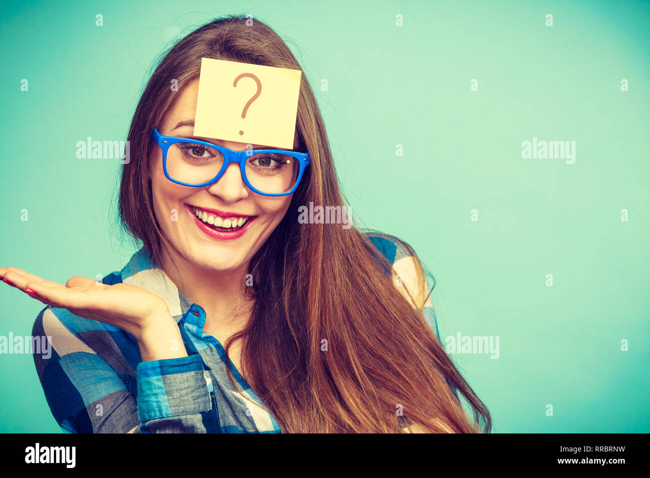 Thinking woman with big nerdy eyeglasses and question mark on forehead ...