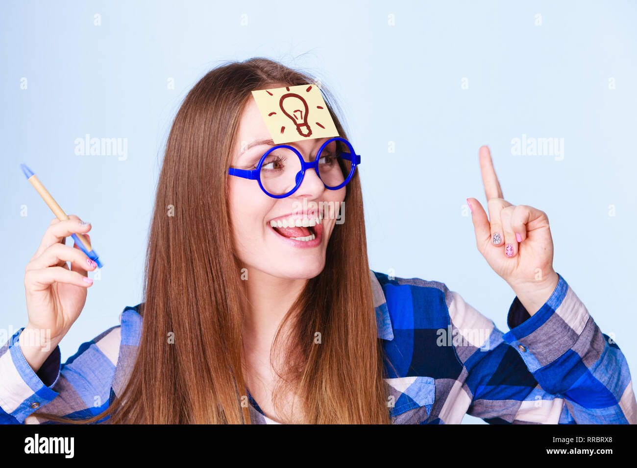 Woman confused thinking seeks a solution, paper card with light idea ...