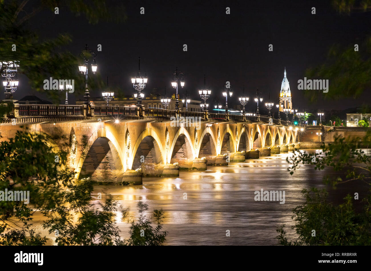 Night view of The Pont de Pierre, bridge over the Garonne river in ...
