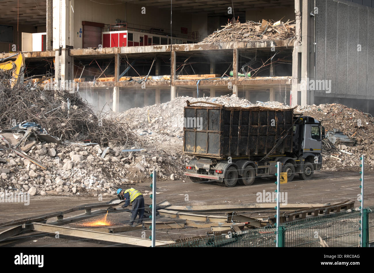 Dumper truck and piles of concrete rubble factory demolition sie Stock ...