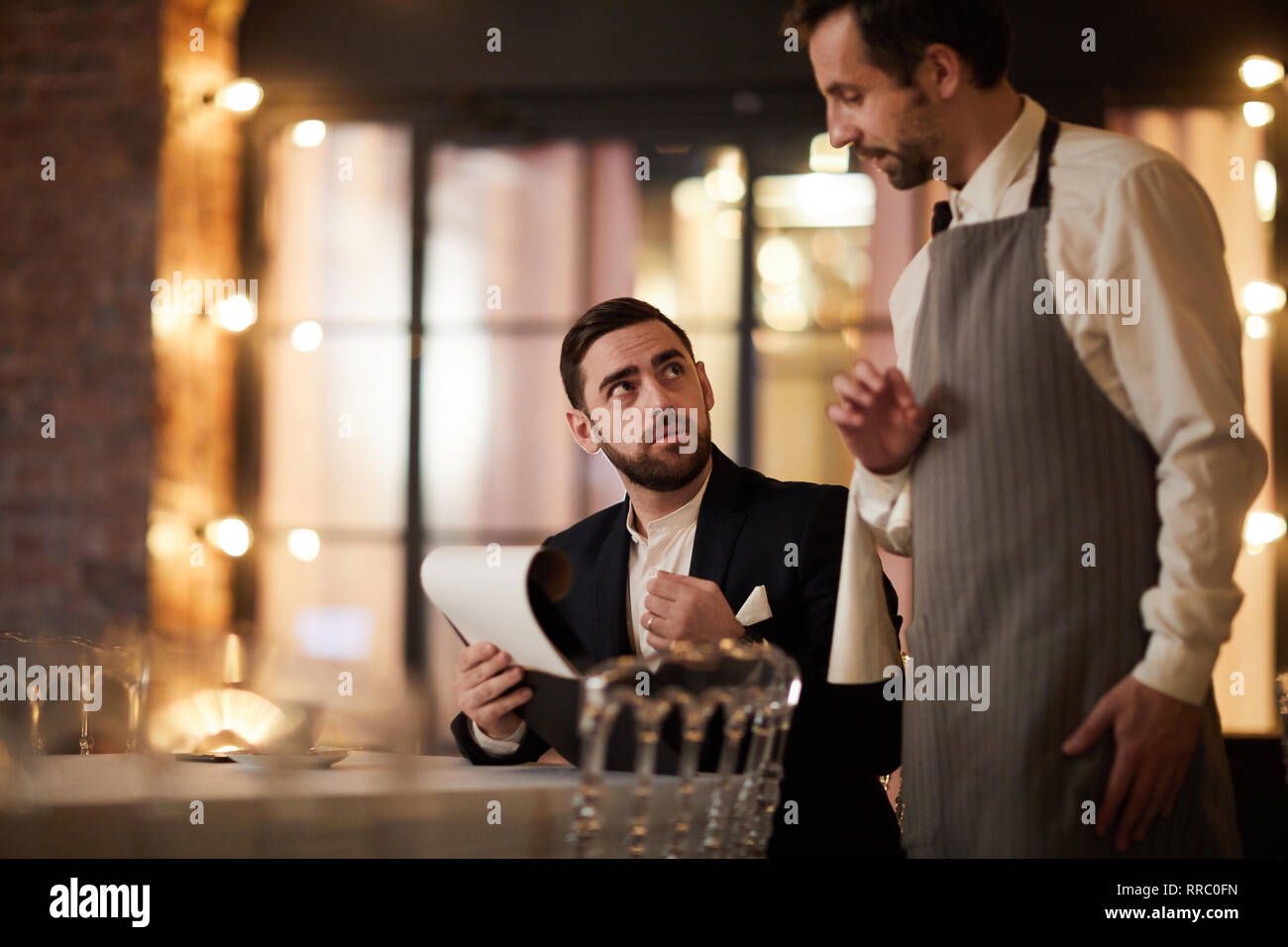 Man Ordering Food in Restaurant Stock Photo - Alamy