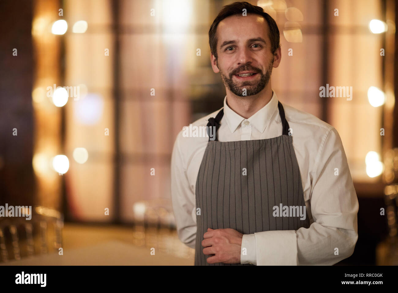 Mature Waiter in Restaurant Stock Photo - Alamy