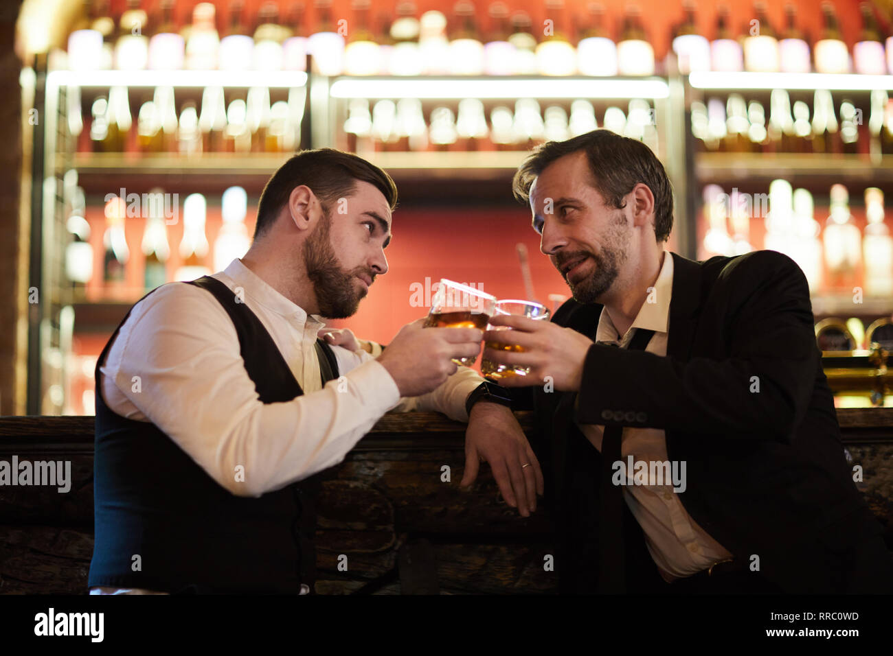 Two Gentlemen Drinking Alcohol Stock Photo - Alamy