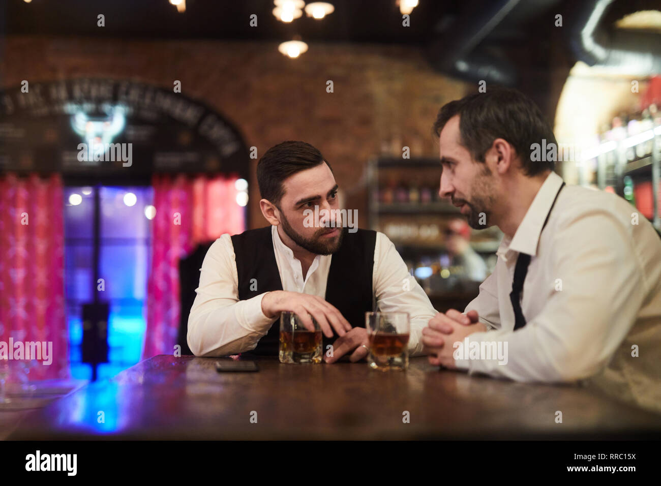 Late Night Chatting in Bar Stock Photo - Alamy